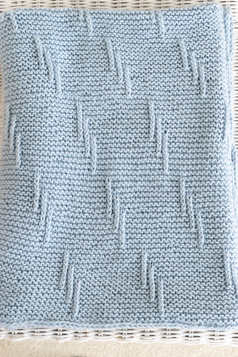 Easy Knit Baby Blanket Pattern - Tiny Trails · Nourish and Nestle